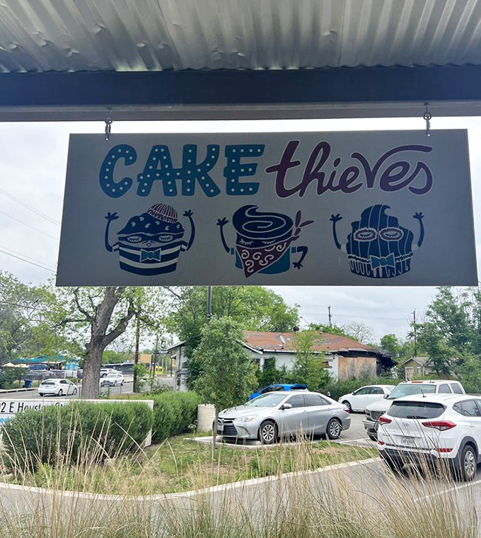 The Cake Thieves sign features cartoon pastry bandits that perfectly capture the spirit of the place. They're stealing hearts one croissant at a time.