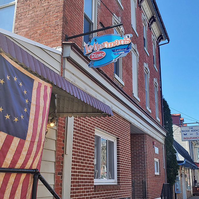 The blue sign beckons like a lighthouse for the hungry. This modest marquee has guided breakfast pilgrims for decades.