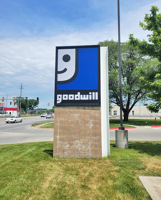 The iconic Goodwill smile logo stands sentinel along 72nd Street. That knowing grin says, "Yes, we have exactly what you didn't know you needed."