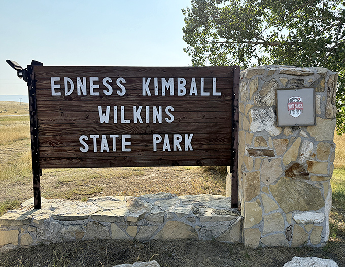 The gateway to tranquility has a name. This sign promises adventure, relaxation, and a temporary escape from your inbox.