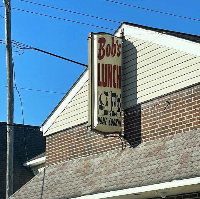 The vintage sign stands as a beacon of hope for hungry travelers&mdash;"Bob's Lunch" and "Home Cooking" being the sweetest words in the English language.