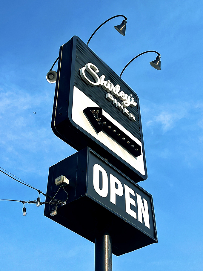 That classic neon sign against a perfect blue sky&mdash;like a beacon guiding hungry travelers to their comfort food destination.
