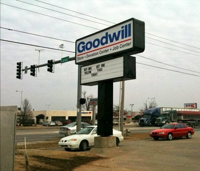 The roadside sign announces daily deals like a town crier, broadcasting bargains to passing traffic on Sunset Avenue.