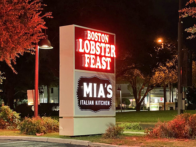 By night, the illuminated sign stands as a beacon for seafood seekers, sharing space with Mia's Italian Kitchen.