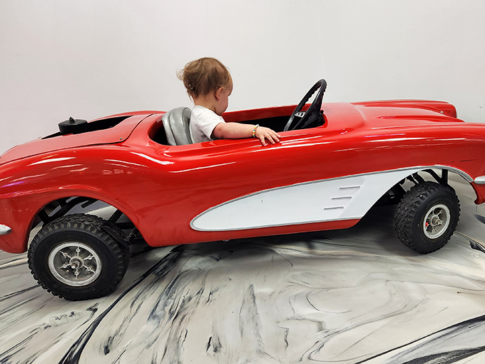 Start 'em young! This kiddie corvette proves car enthusiasm is hereditary, passing from generation to generation like baldness, but much more fun.