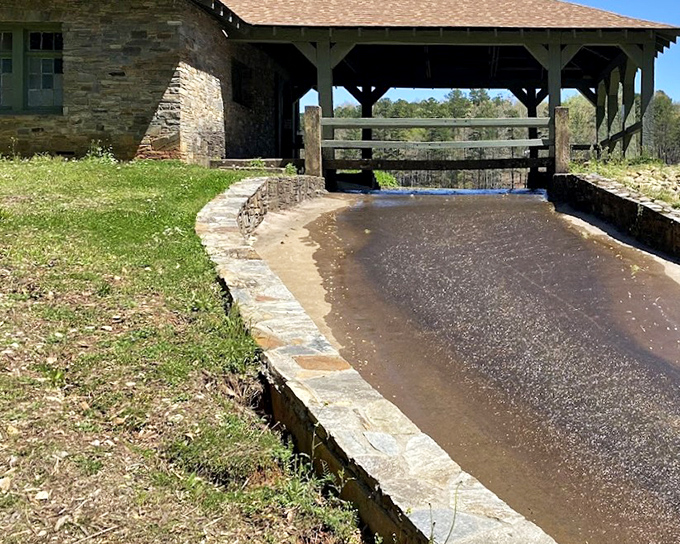 The historic spillway channels water with the same engineering principles used for generations. Practical infrastructure that somehow manages to be photogenic.