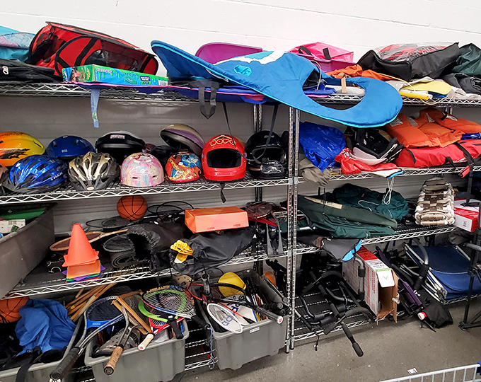 The sporting goods corner: where golf clubs, helmets, and mysterious equipment pieces create a jumble gym of recreational possibilities.