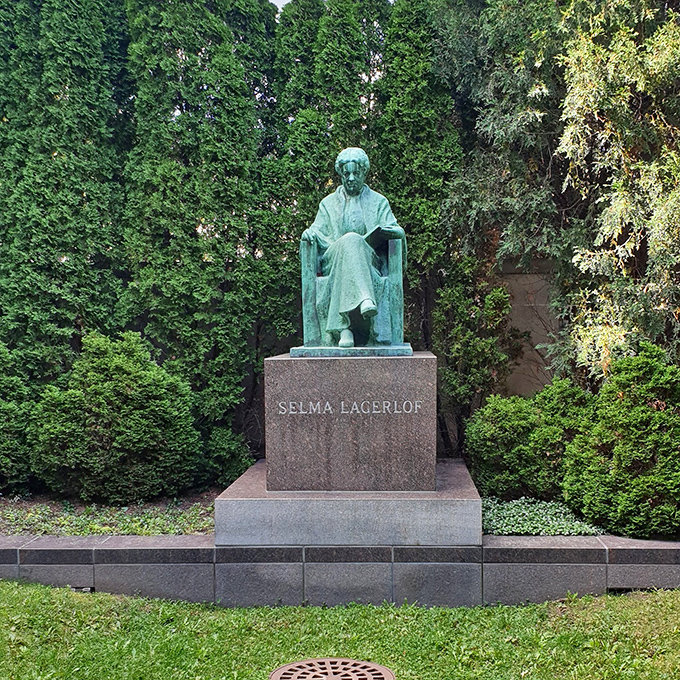 The statue of Selma Lagerlöf, first female Nobel Prize winner in literature, sits serenely among the greenery, as if taking a thoughtful pause between writing masterpieces.