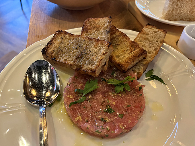 Steak tartare that's dressed better than most people at dinner&mdash;a perfect disc of hand-cut beef with all the right accessories.