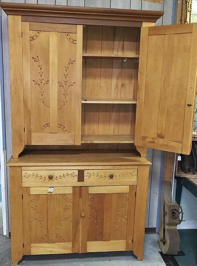 This step-back cupboard has more character in its wooden frame than most modern furniture has in an entire showroom.