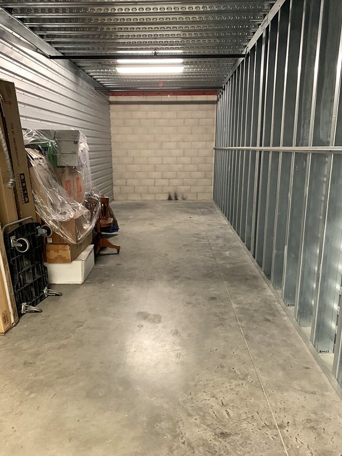Storage units: where yesterday's impulse buys await tomorrow's treasure hunters. These metal walls have seen more abandoned hopes than a gym in February.