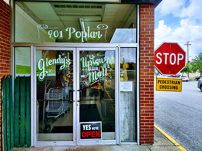 The entrance at 901 Poplar&mdash;where adventure begins and wallets surrender. That "YES WE'RE OPEN" sign might be the best invitation you'll get all day.