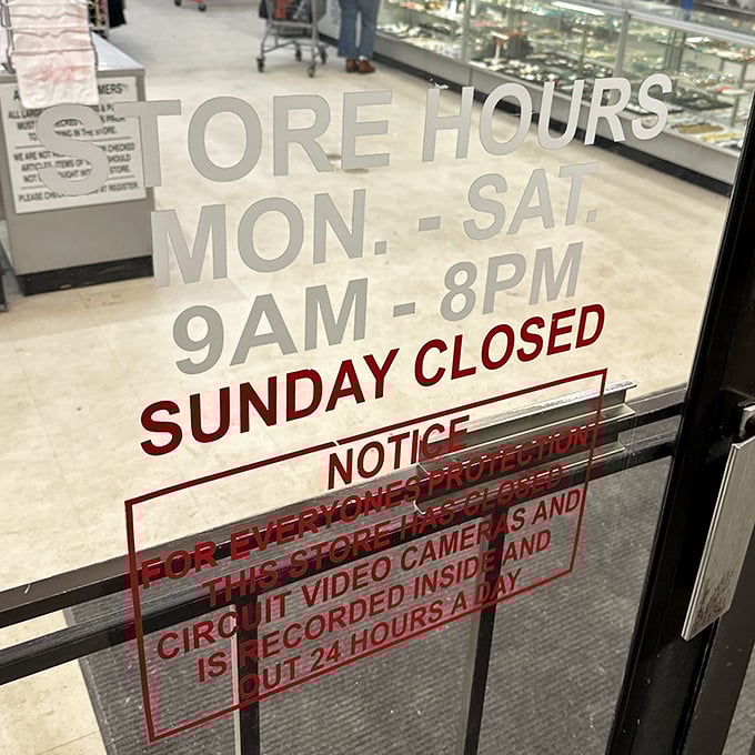 Store hours posted clearly&mdash;a thrifter's schedule to live by. The "closed Sunday" notice gives both shoppers and bargains a day of rest.