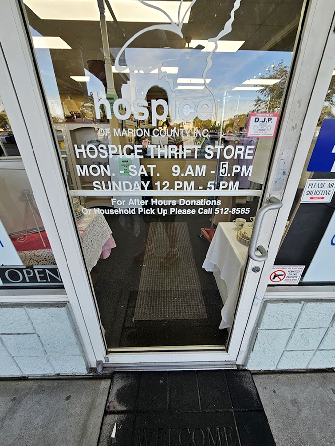 Store hours clearly posted for serious bargain hunters. The phone number for household pickups? That's community service with style.