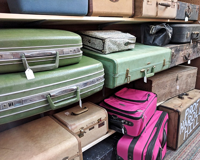 Suitcases stacked like colorful building blocks of travel history. Each one carried someone's essentials to destinations we can only imagine.
