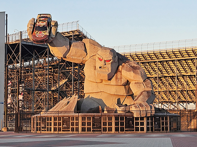 Sunset bathes Miles in golden light, transforming the concrete behemoth into a majestic silhouette against the speedway's grandstands.