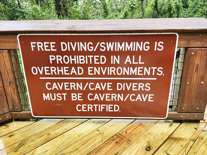 Safety first! This sign reminds us that cave diving requires proper certification &ndash; because some adventures need a bit of preparation.