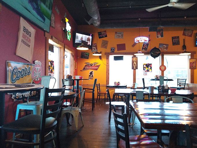 Rustic tables bathed in warm light await the next round of BBQ enthusiasts&mdash;each wooden surface telling stories of meals past.