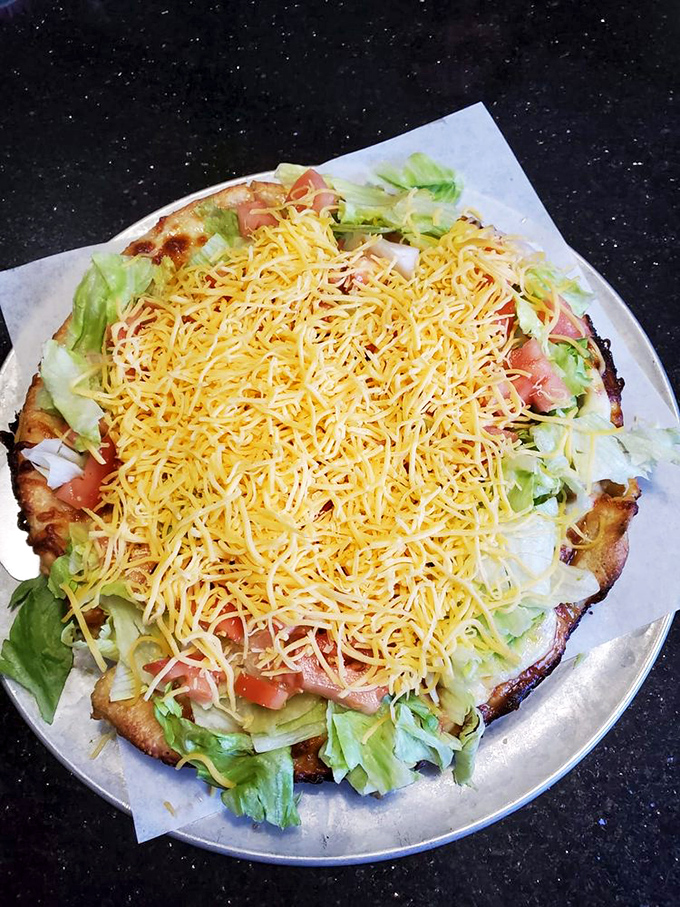 The taco pizza combines two perfect foods into one glorious creation. It's like someone read your mind after you couldn't decide what to order.