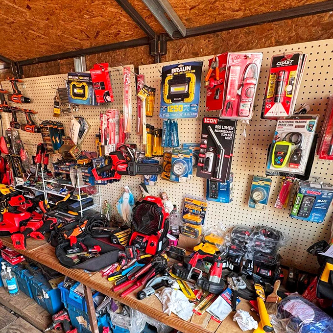 That pegboard of power tools looks like someone raided a hardware store and decided sharing the wealth was mandatory.