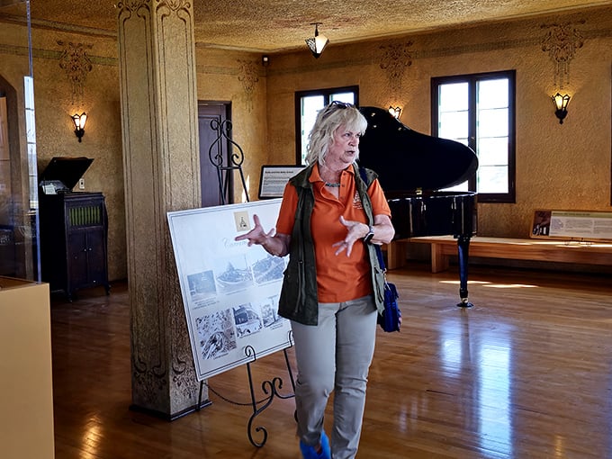 Tour guides bring the castle's stories to life, gesturing enthusiastically as they connect visitors to the dreams and schemes of Arizona's past.