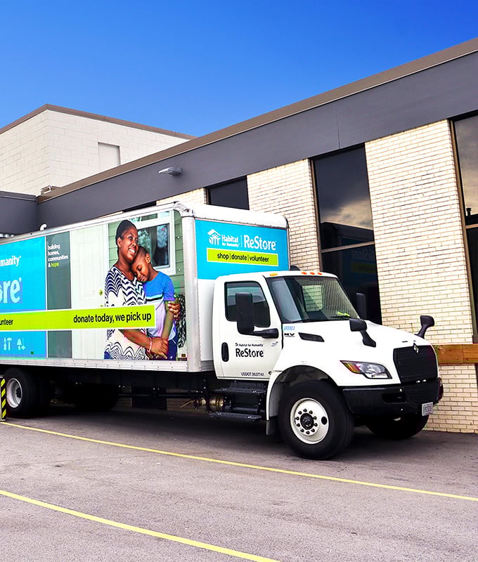 Even the delivery truck looks cheerful about its mission, ready to transport your finds home while supporting families in need.