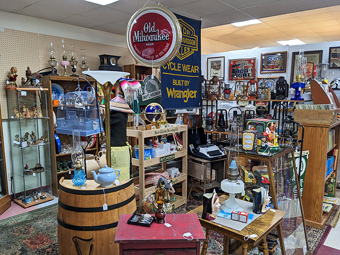 Old Milwaukee memorabilia shares space with vintage treasures atop a rustic barrel. Wisconsin's brewing history displayed with pride and nostalgia.