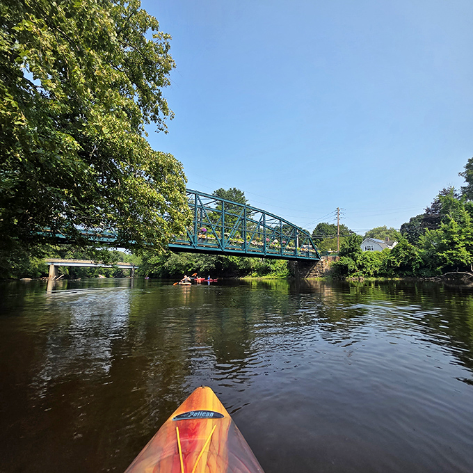 From river level, kayakers get the under-bridge perspective &ndash; like peeking at the structural underpinnings of a floral fashion show.