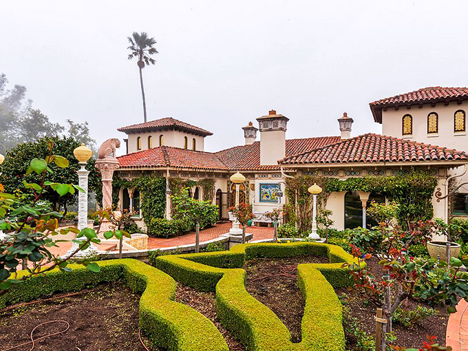 Morning fog embraces the grounds like nature's own special effect, turning this Mediterranean-inspired courtyard into something straight out of a romantic film.