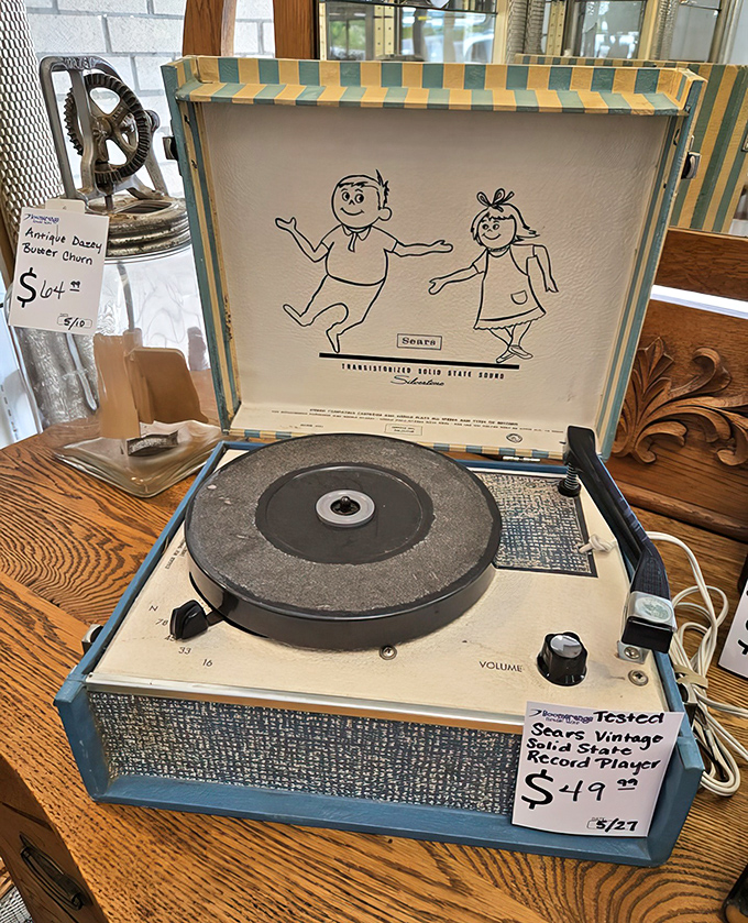 A cheerful vintage record player awaits vinyl collections, proving analog audio experiences don't require boutique prices or hipster credentials.