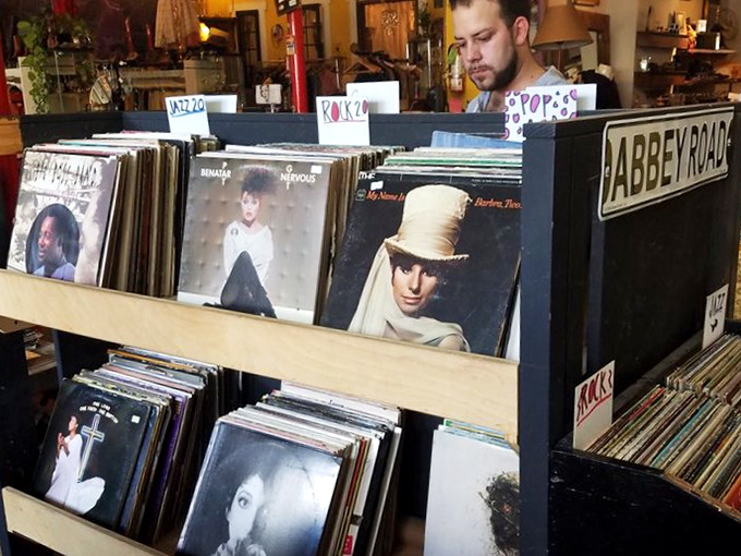 The vinyl section, organized by genre, where music lovers can physically flip through history instead of just scrolling through it.