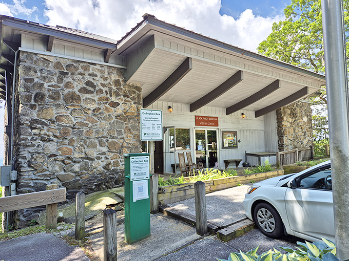 The visitor center's rustic stone architecture blends perfectly with its mountain setting. Inside, friendly rangers wait to share trails that match your ambition level.