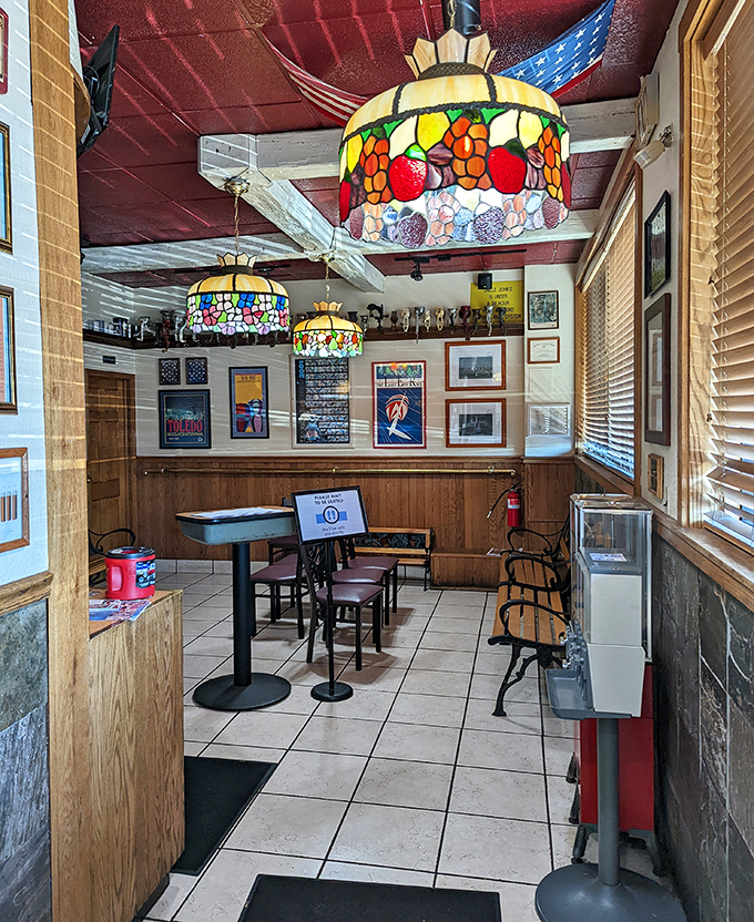 The waiting area's stained glass lamps hang like breakfast jewelry, setting the tone for the comfort food masterpieces to come.