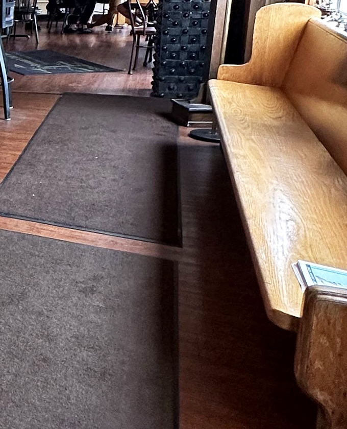 The waiting area's wooden bench has witnessed countless hungry arrivals and countless satisfied departures&mdash;a silent historian of seafood satisfaction.