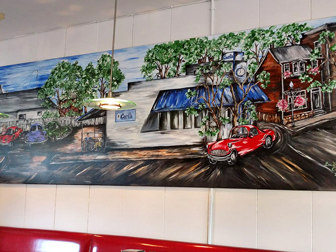 Wall art depicting Carl's through the decades. Like a time capsule with better lighting and the promise of cheeseburgers. 