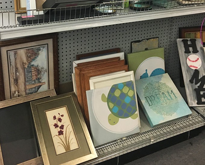 Wall art gallery where someone's "no longer sparks joy" becomes your living room's conversation-starting masterpiece.