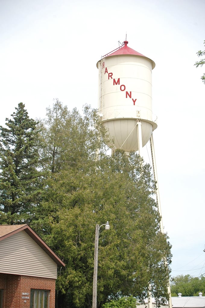 Harmony's water tower stands as both practical infrastructure and iconic landmark, spelling out the town's name for travelers and serving as an unofficial compass point.