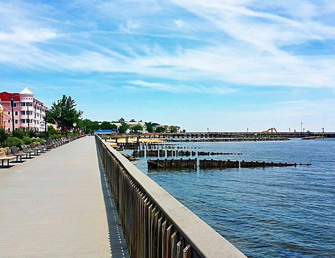 The boardwalk stretches like a promise along the shoreline, inviting leisurely strolls and spontaneous bench-sitting contemplation.