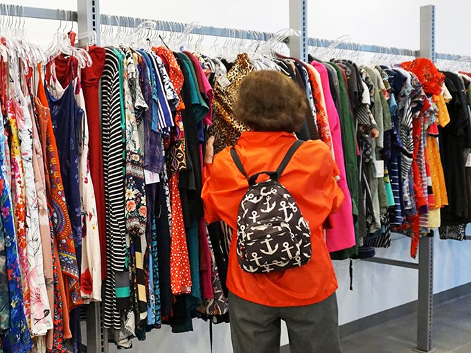 The technicolor wardrobe department where vintage patterns and contemporary styles create a fashion timeline spanning decades of American trends.