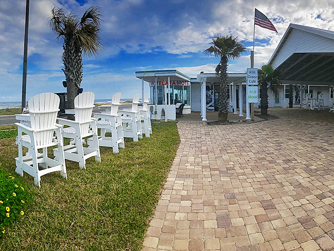 White Adirondack chairs at A1A Ocean Club invite you to sit a spell, because rushing is against the Flagler Beach town charter.