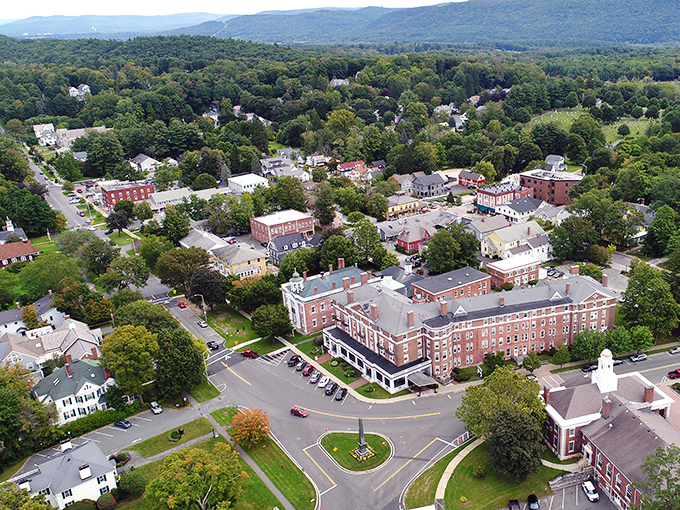 From above, Lenox reveals its perfect nestling among the Berkshire hills. A town that understood the assignment: blend harmoniously with nature while creating a vibrant community center.