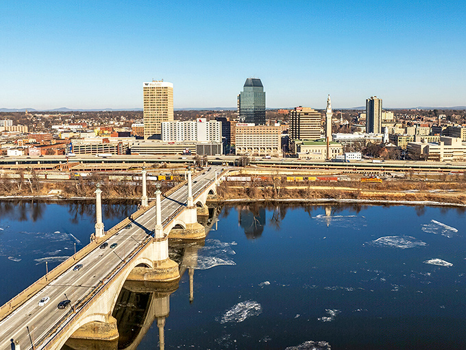 The Memorial Bridge spans the Connecticut River like a silver ribbon, connecting Springfield's urban charm to endless possibilities on the horizon.