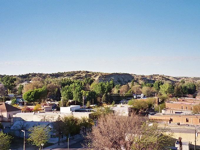 From above, Aztec reveals itself nestled between mesas and mountains, a human settlement in harmony with the dramatic landscape that cradles it.