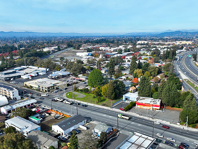 This aerial view reveals Santa Rosa's thoughtful layout, with neighborhoods nestled among greenbelts and the surrounding hills providing a natural boundary to sprawl.