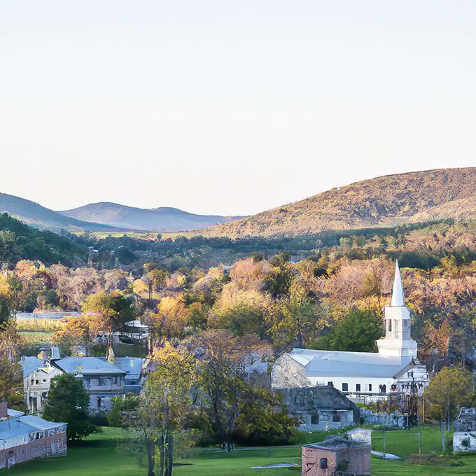 Autumn transforms Brandon into a painter's palette of reds and golds. That white church steeple punctuates a landscape of seasonal perfection.