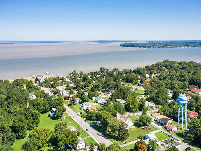 From above, Denton reveals its perfect positioning near the water, where modest homes enjoy million-dollar views without the million-dollar tax bills.