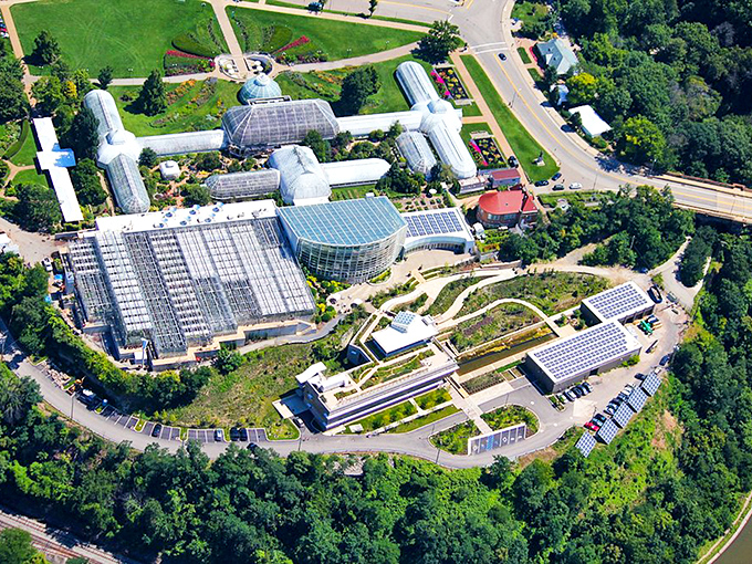 From above, Phipps reveals itself as a glass labyrinth nestled in greenery, like a secret botanical society headquarters hiding in plain sight.