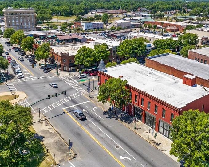 Bird's eye view of a town that proves bigger isn't always better – sometimes it's just more expensive.
