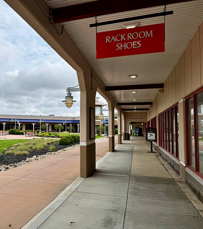 The Rack Room Shoes corridor stretches toward the horizon, promising comfort for feet that have logged miles in pursuit of deals.