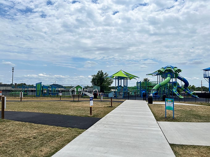 American Legion Park's playground stands like a colorful oasis of childhood joy, where slides and swings await their next adventure-seekers.